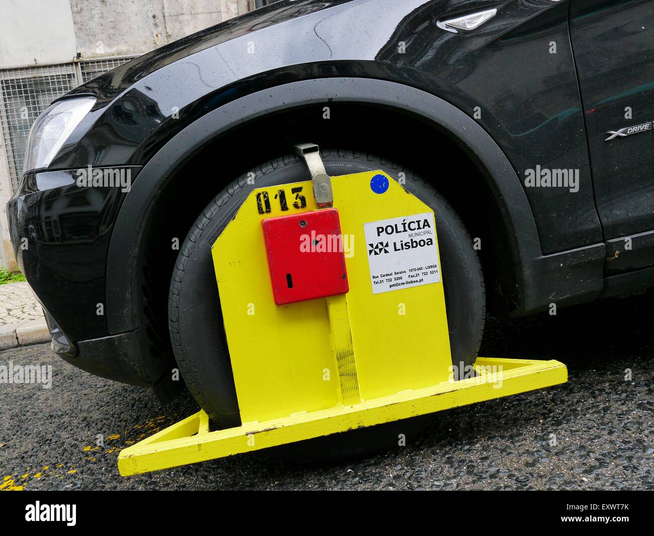 Car park wheel clamp hi-res stock photography and images - Alamy