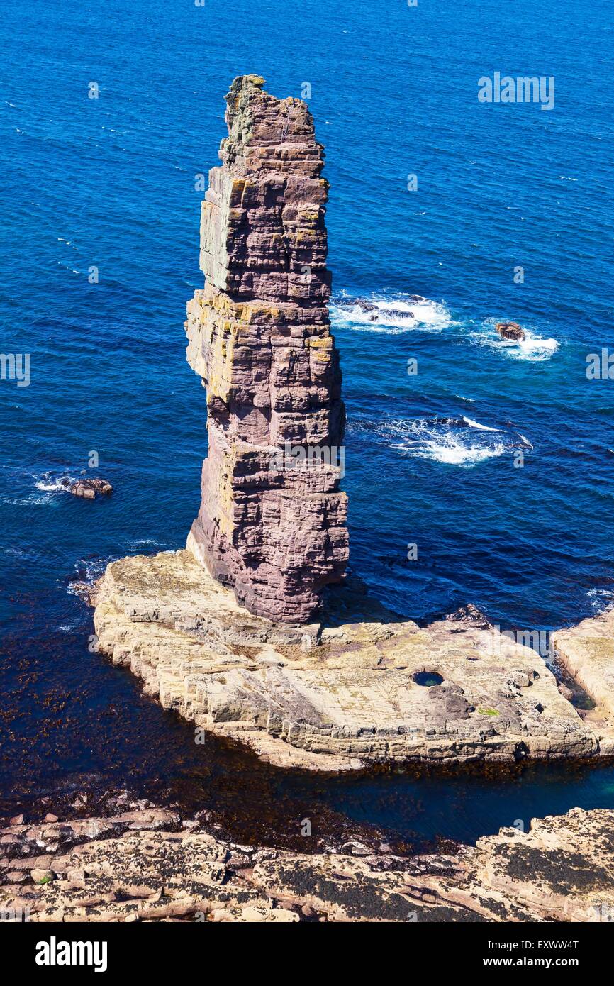 Coastal landscape in Northwestern Scotland with sea stack Am Buachaille ...