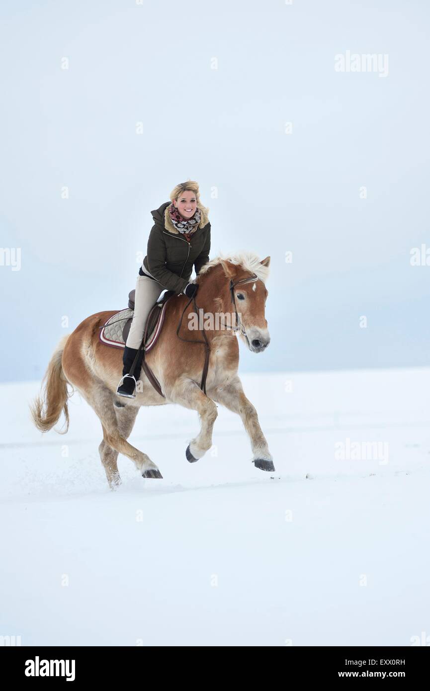 Woman riding horse in snow hi-res stock photography and images - Alamy