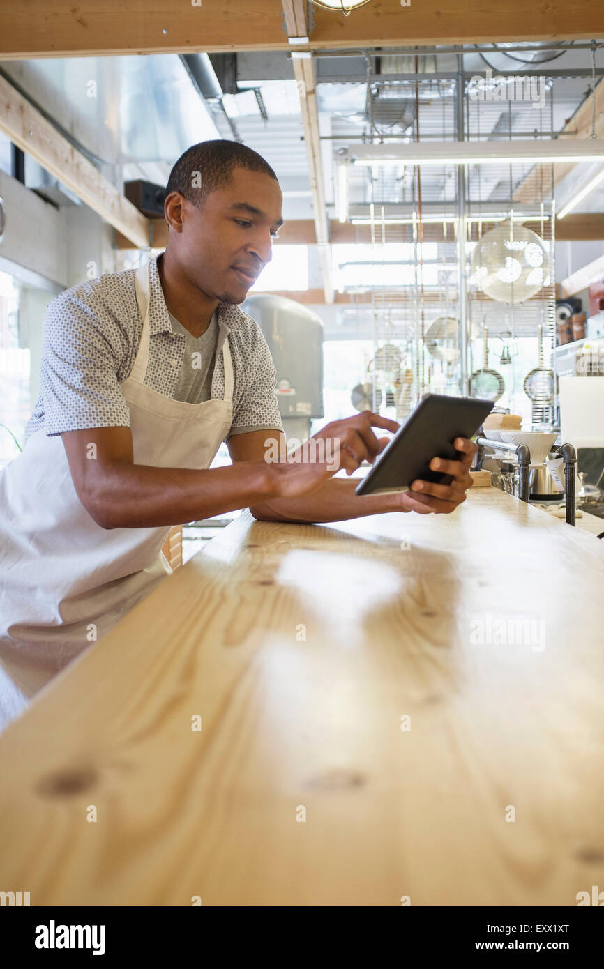 Male business owner tablet hi-res stock photography and images - Alamy