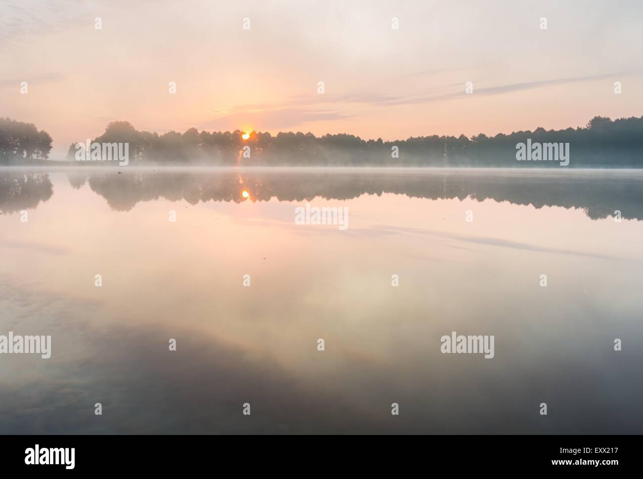 Sunrise over calm lake hi-res stock photography and images - Alamy
