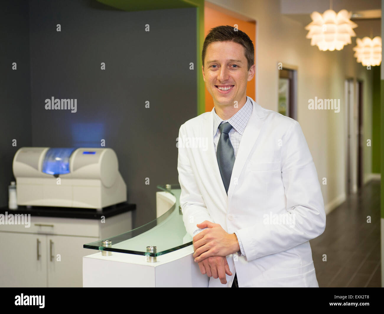 Portrait of smiling dentist Stock Photo - Alamy