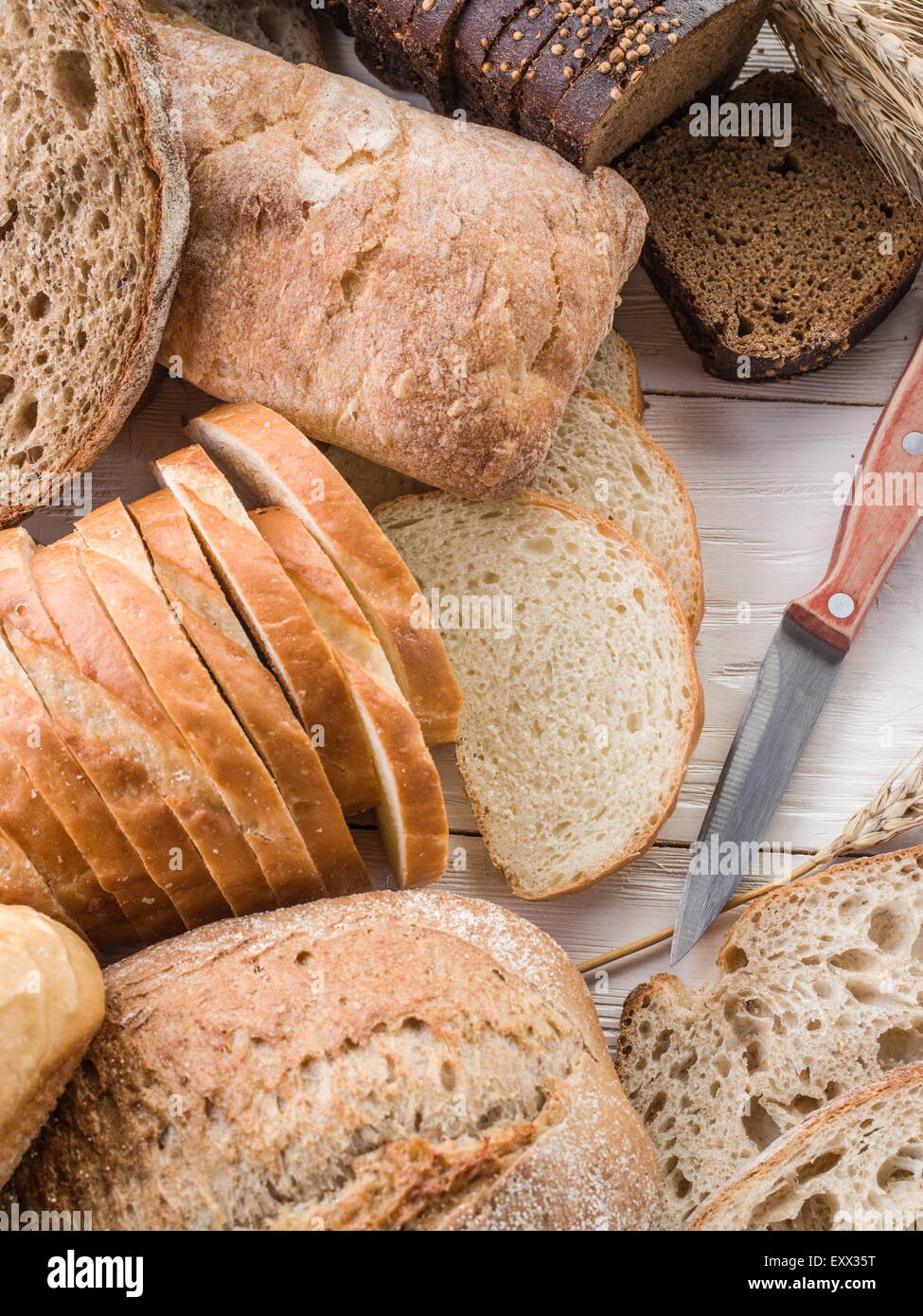 The bread and a wheat on the wooden desk Stock Photo - Alamy
