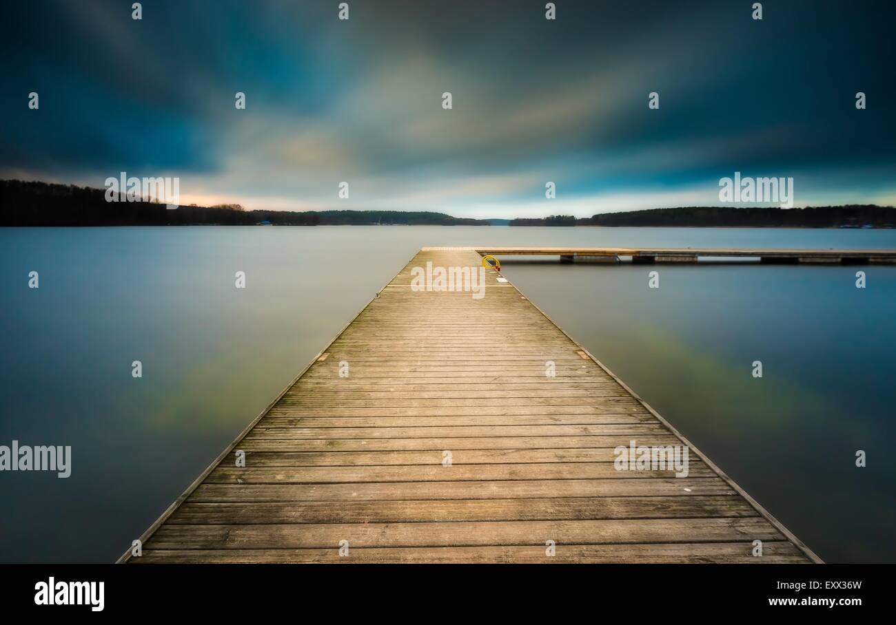 Beautiful lake landscape with jetty. Long time exposure photo with ...