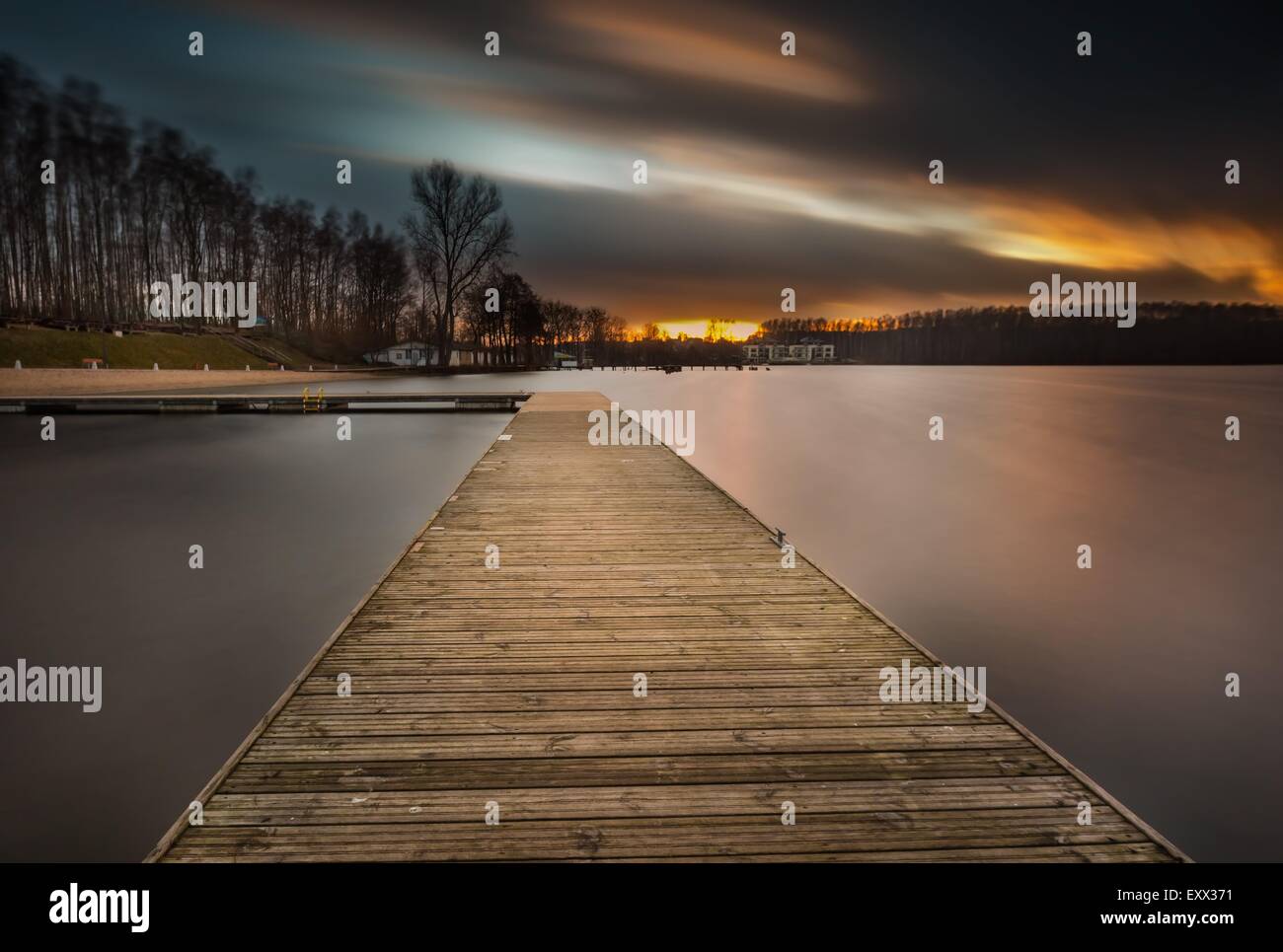 Beautiful lake landscape with jetty. Long time exposure photo with ...