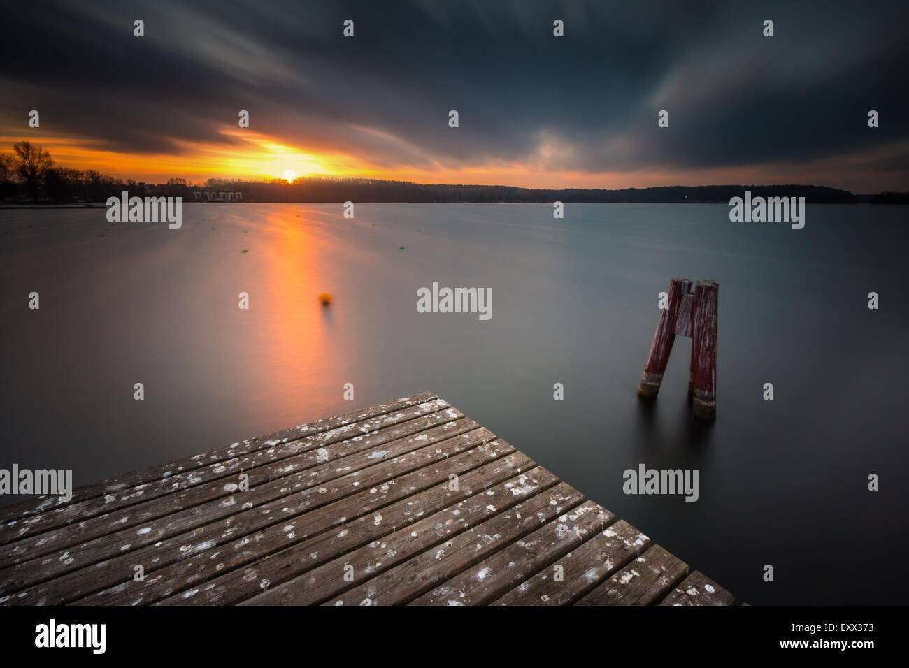 Beautiful lake landscape with jetty. Long time exposure photo with ...
