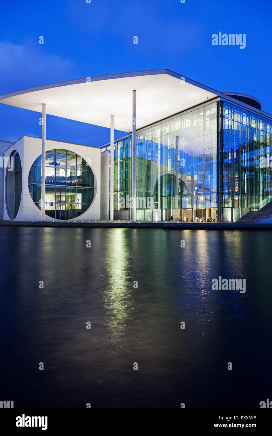 Riverfront parliament office building illuminated at dusk Stock Photo ...