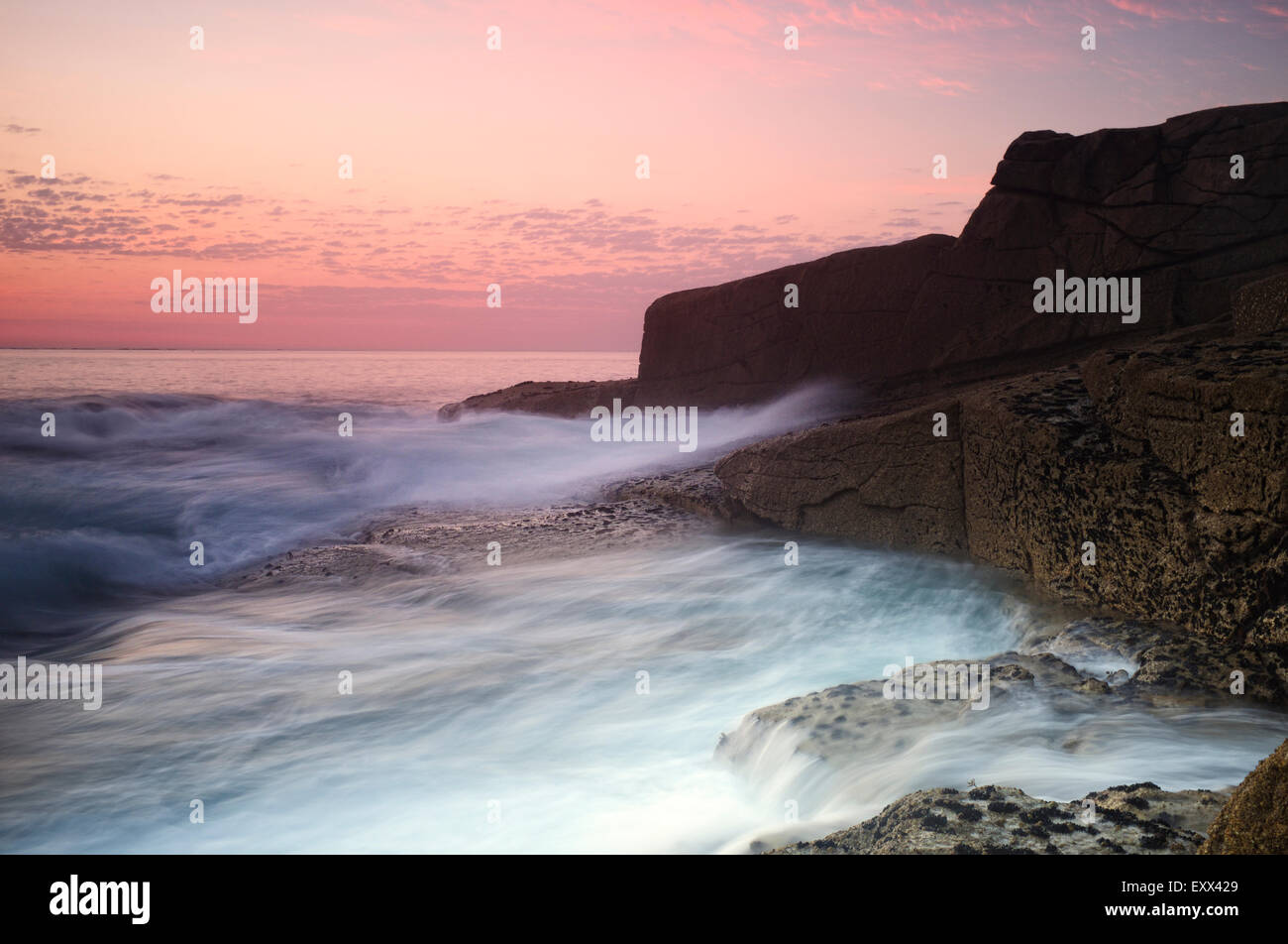 Rocky coastal scene at sundown Stock Photo - Alamy