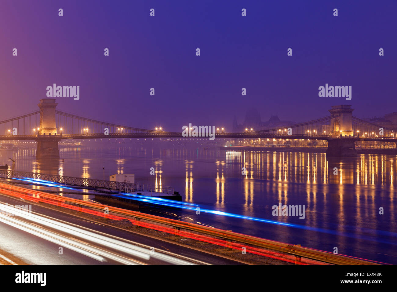 Illuminated Chain Bridge and light trails Stock Photo - Alamy