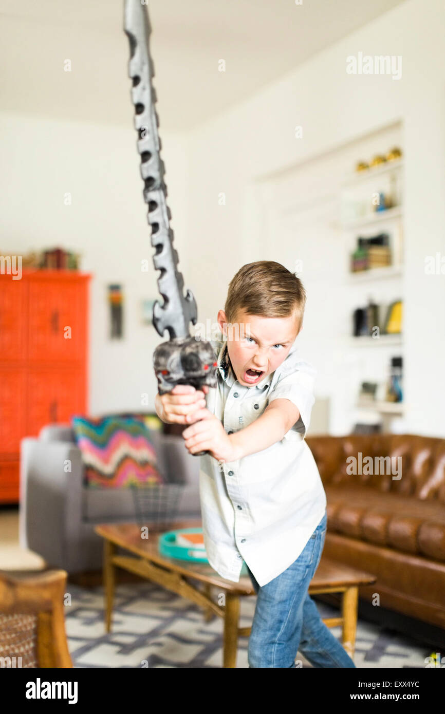 Boy (6-7) playing with sword Stock Photo - Alamy