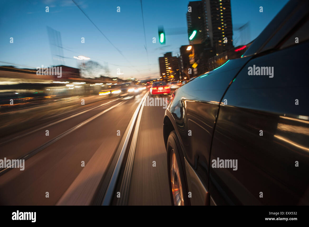 Car speeding along railroad tracks Stock Photo - Alamy