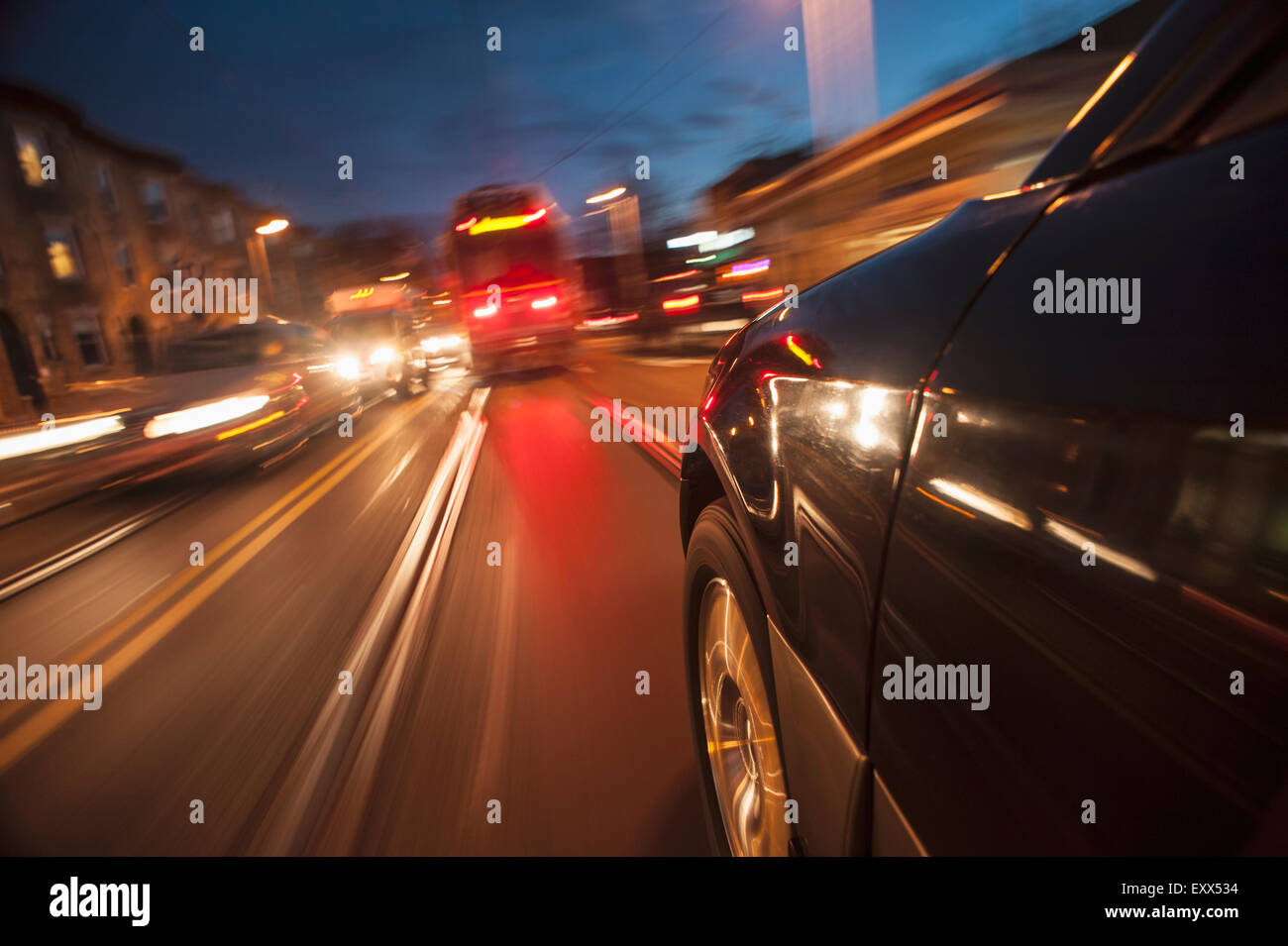 Car speeding along railroad tracks Stock Photo - Alamy