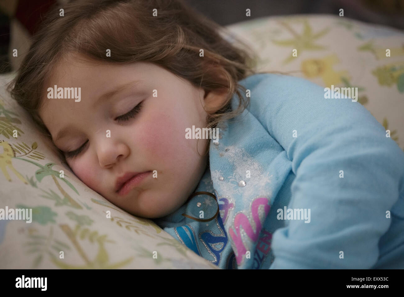 Girl sleeping in bed Stock Photo - Alamy
