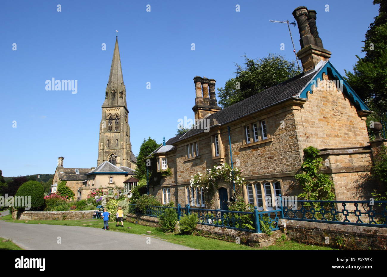 The spire of st. Peter's Church rise above Edensor villlage on the ...