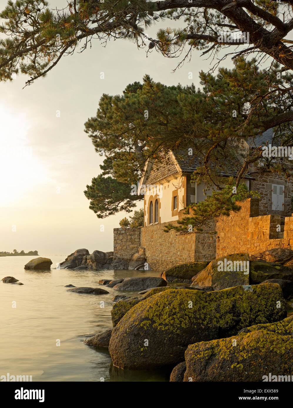A shoreside house at Penvern during high tide Stock Photo - Alamy