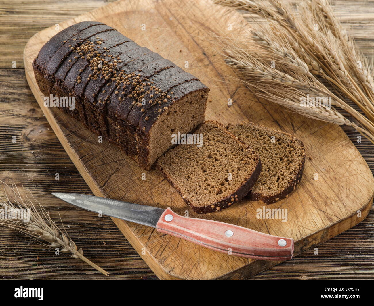 Sliced black bread on the old wooden plank Stock Photo - Alamy