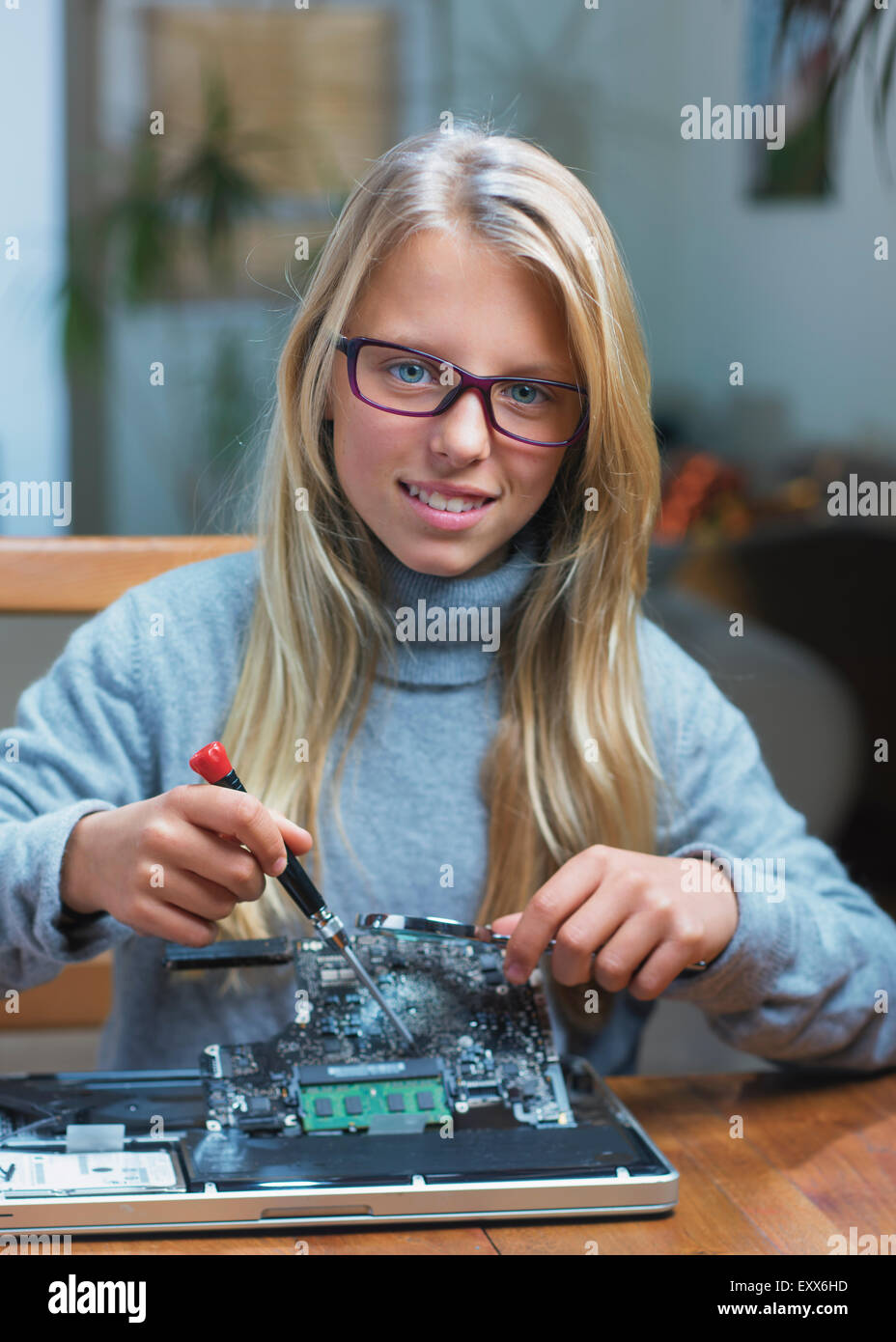 Young teenager fixing a motherboard Stock Photo - Alamy
