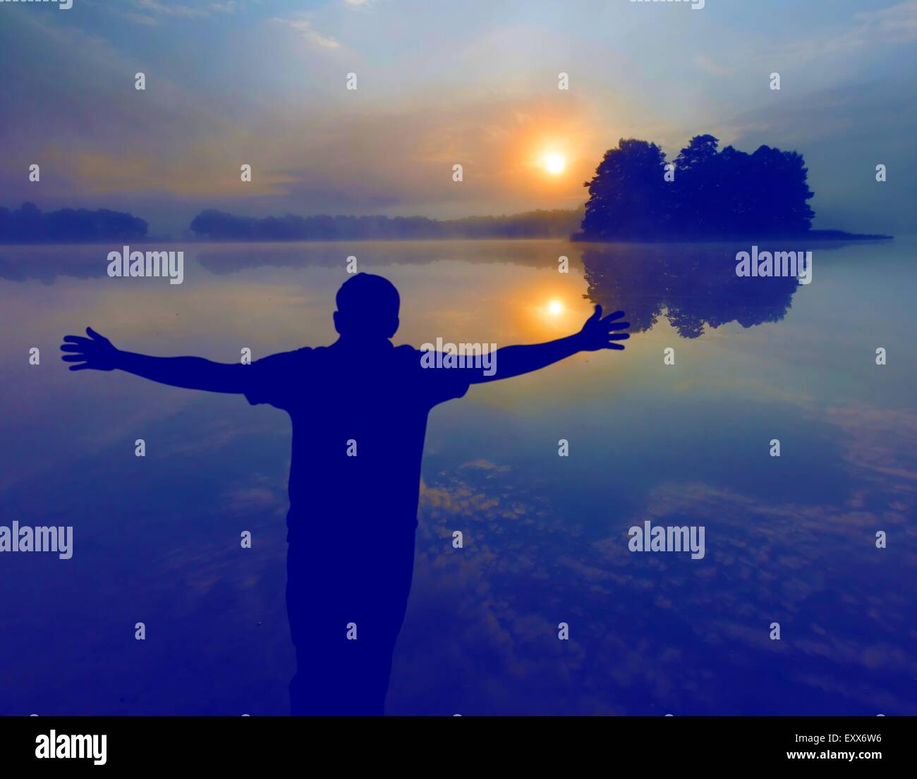 Man watching a sunrise over lake. Human silhouette. Photo with vintage ...
