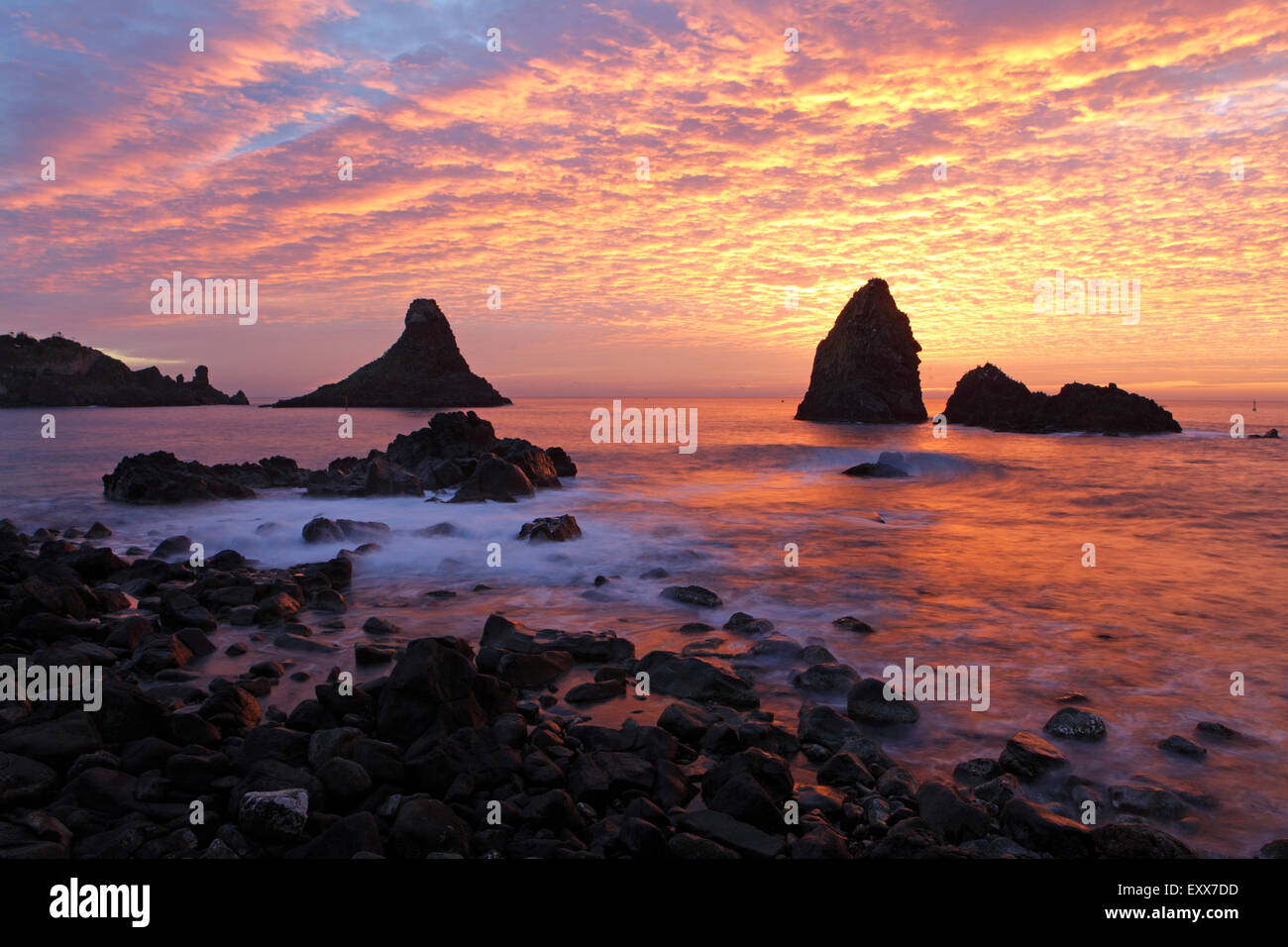 Cyclops stacks in Aci Trezza at sunrise, Sicily, Italy Stock Photo - Alamy