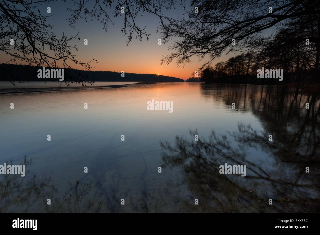 Beautiful, mystic sunrise over lake. Summertime in Mazury lake district ...