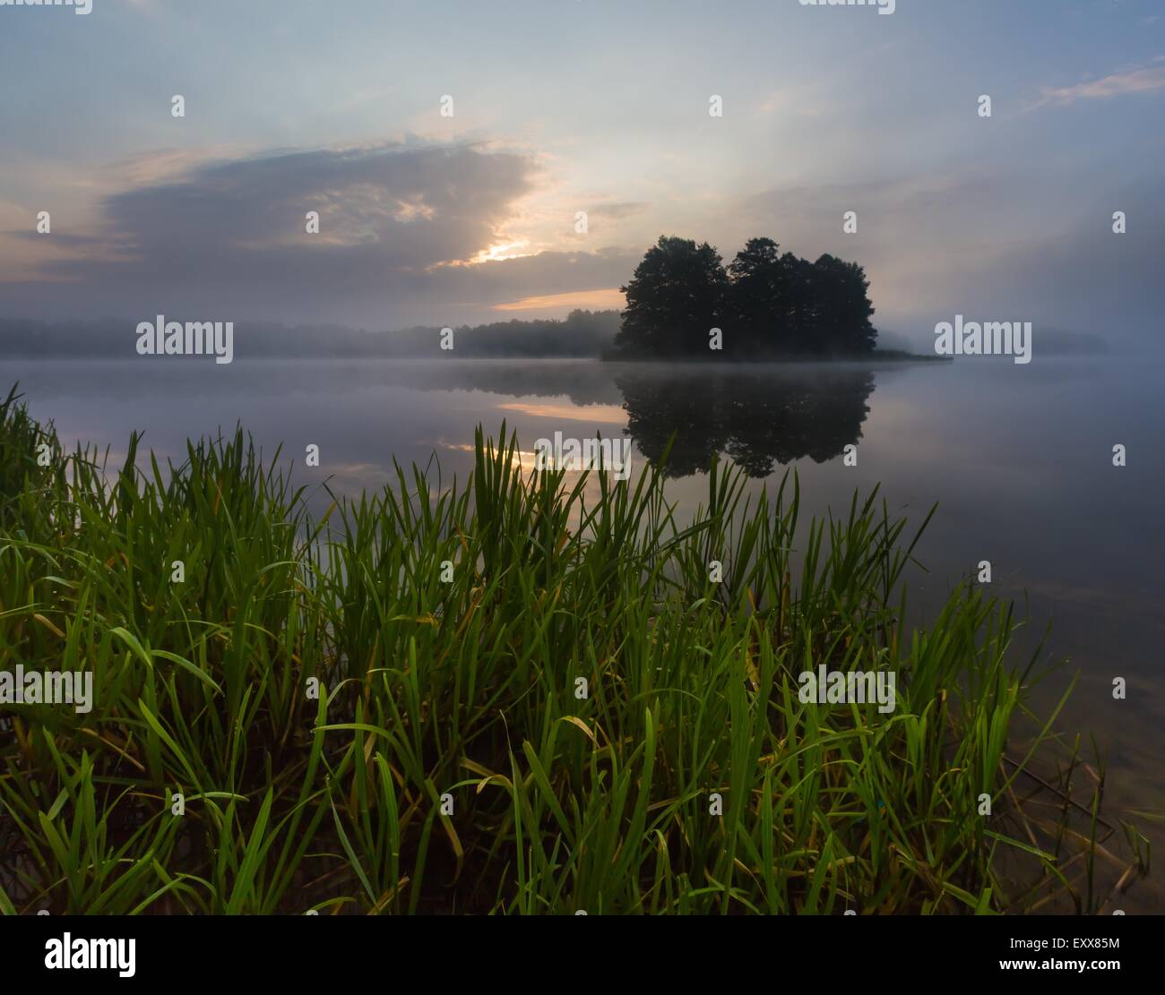 Beautiful, mystic sunrise over lake. Summertime in Mazury lake district ...