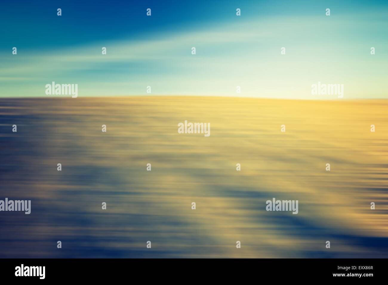 Blurry, defocused field landscape useful as background. Out of focus ...