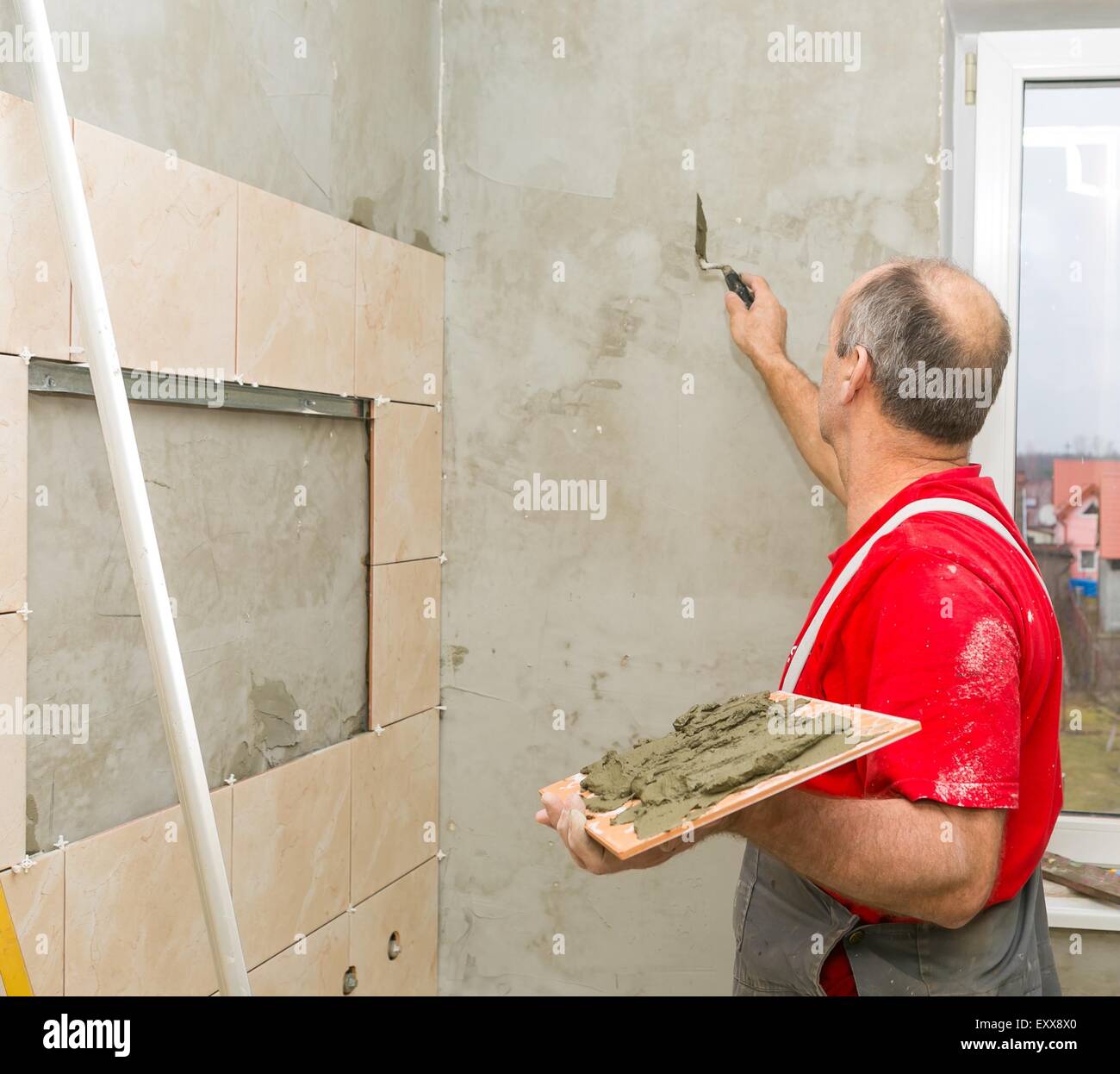construction mason man hands on tiles work with cement mortar Stock ...