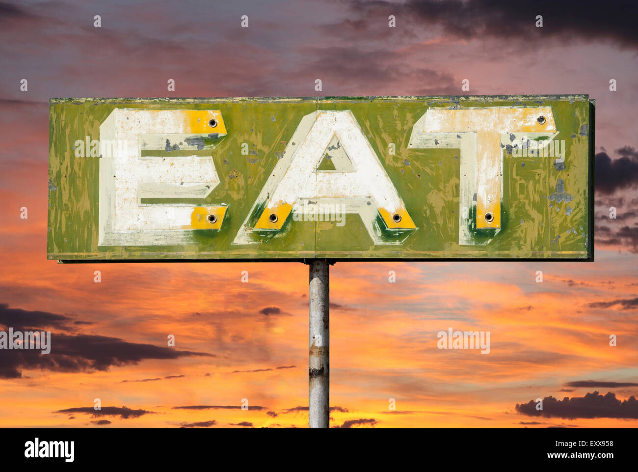 Faded vintage eat sign with sunset sky Stock Photo - Alamy