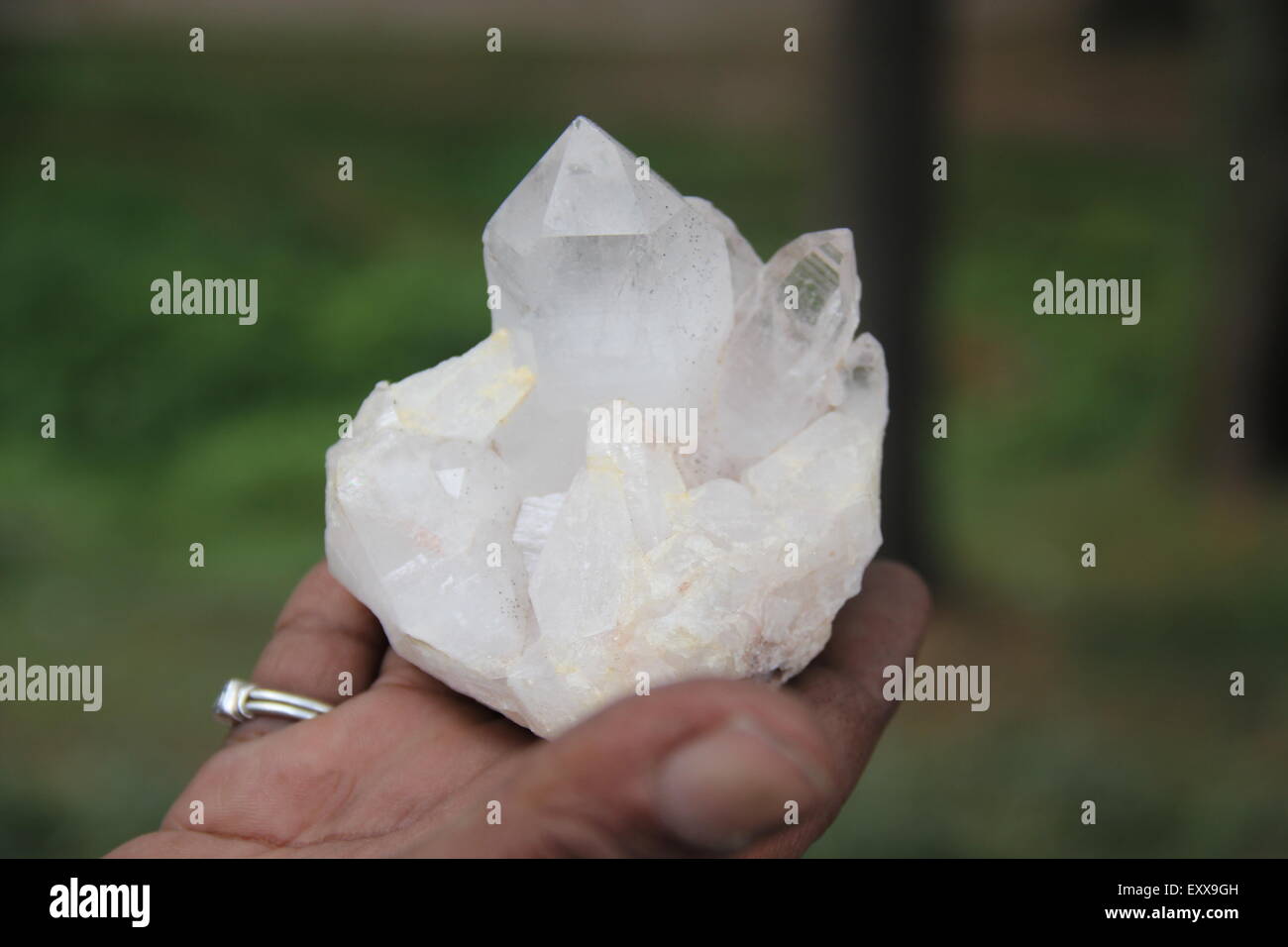 Quartz in the palm of your hand Stock Photo - Alamy