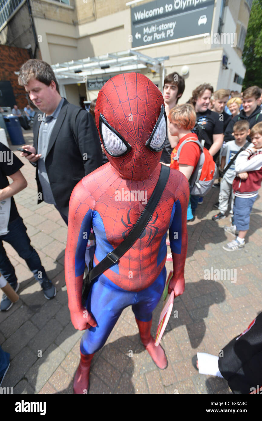 People queue for the London Film & Comic Con at London Olympia 2015 ...