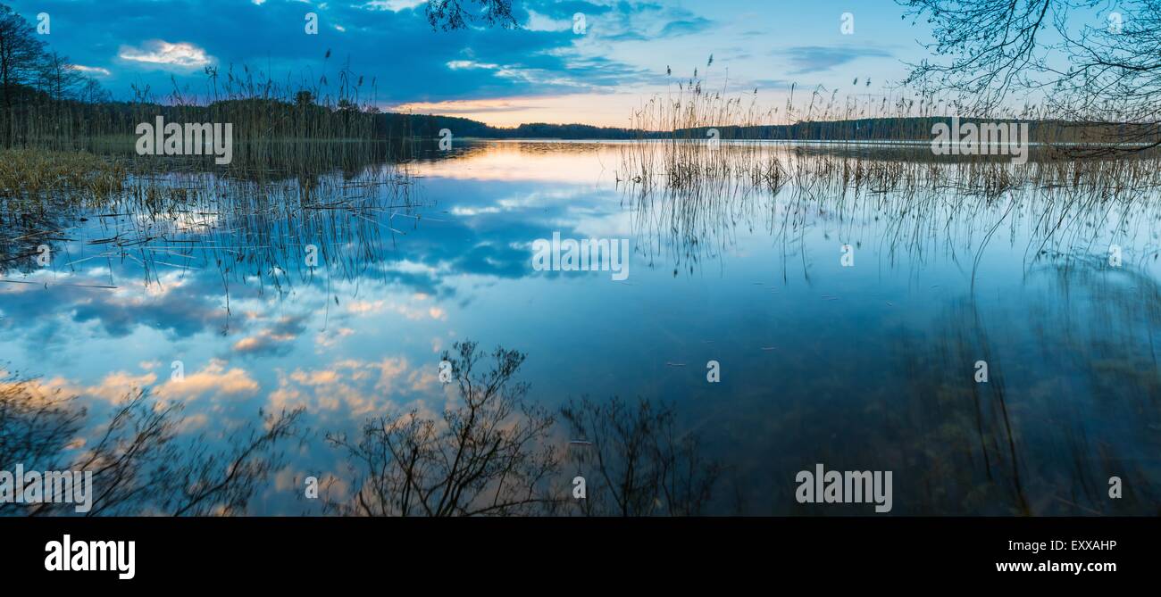 Evening lake landscape with sky reflected in water. Beautiful polish ...