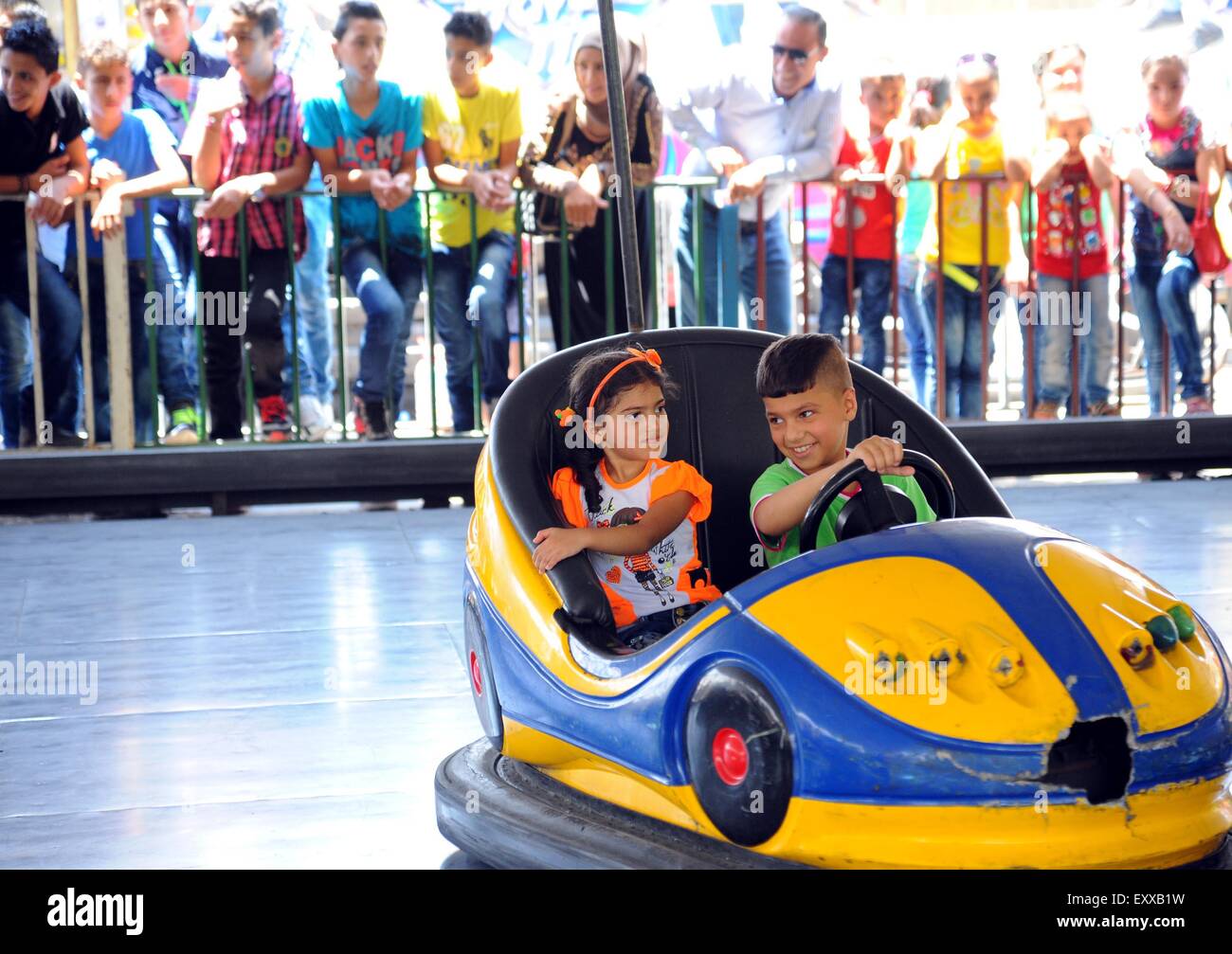 Damascus, Syria. 17th July, 2015. Syrian kids play at an amusement park ...