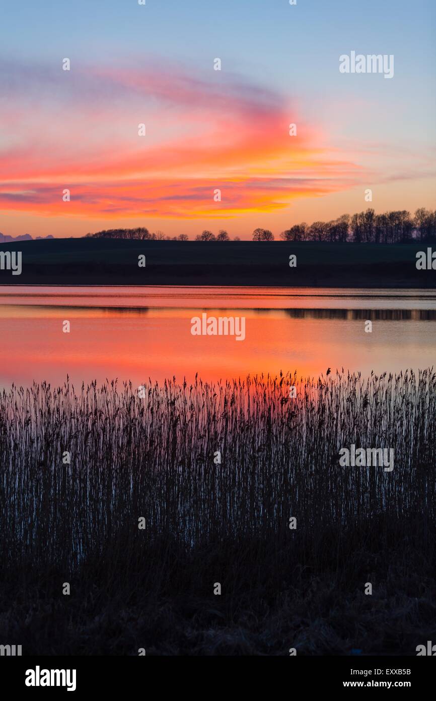 Beautiful sunset over calm lake. Colorful and vibrant landscape of lake ...