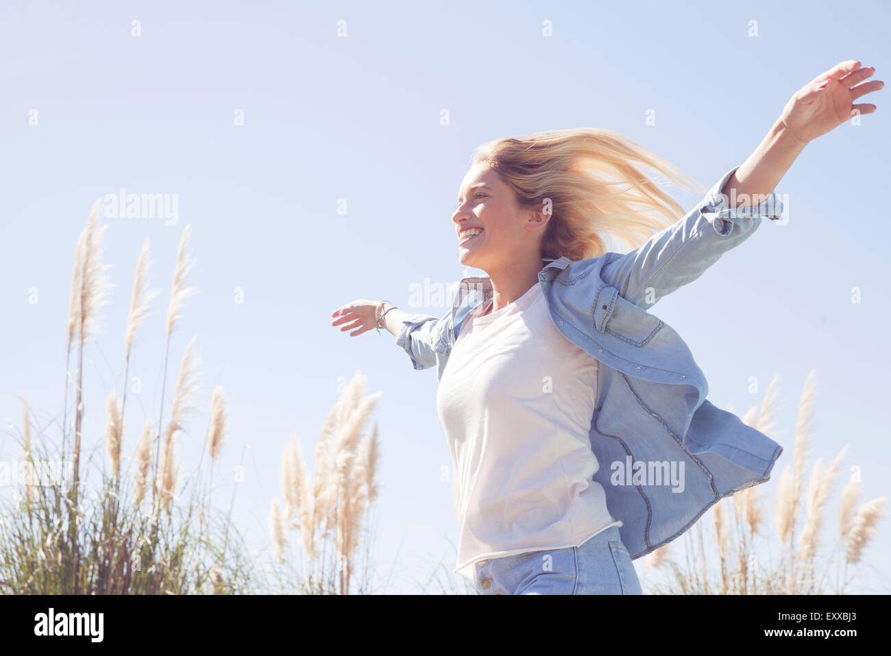 Woman enjoying fresh air outdoors Stock Photo - Alamy
