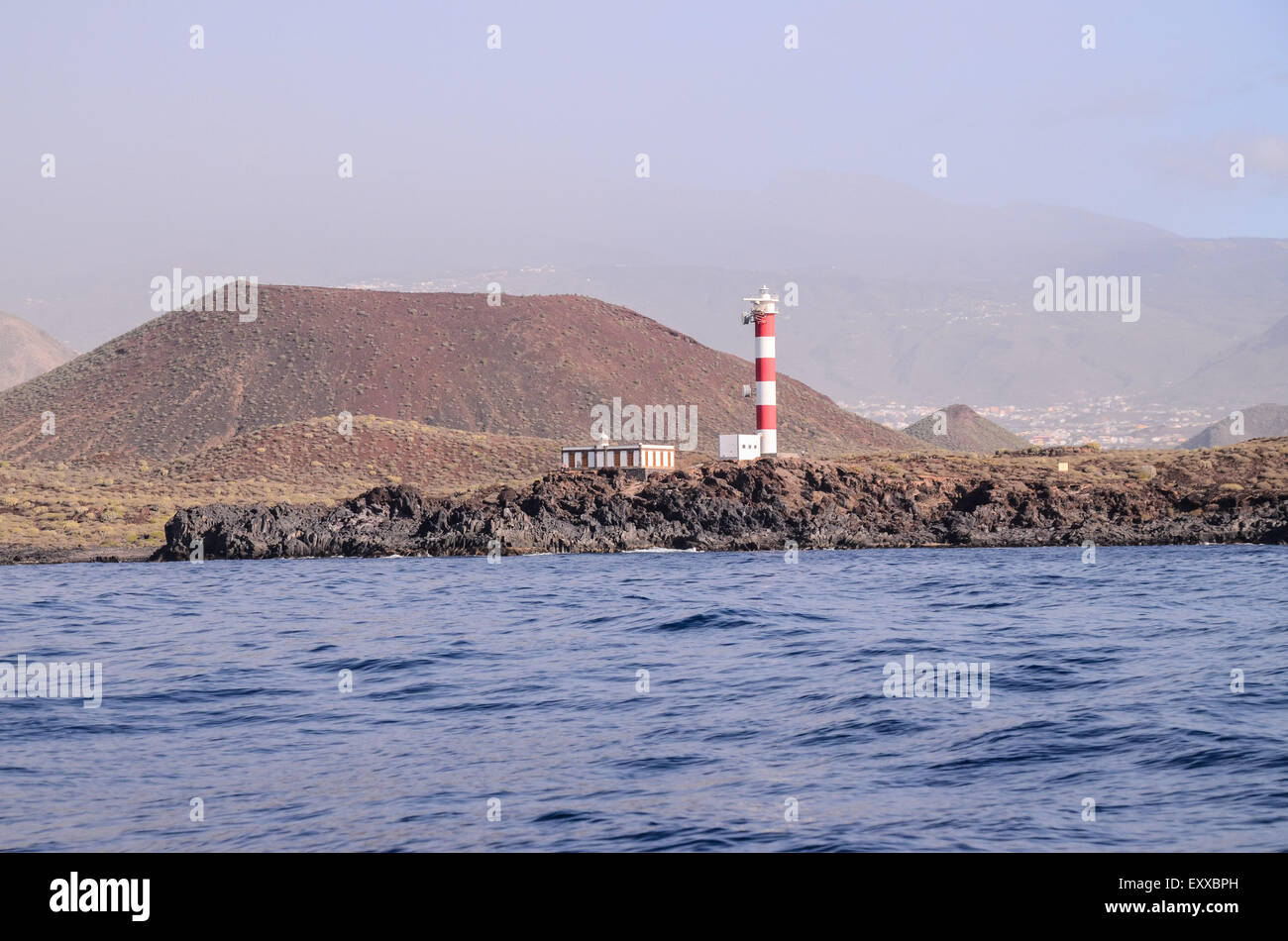 High Lighthouse near the Coast Stock Photo - Alamy