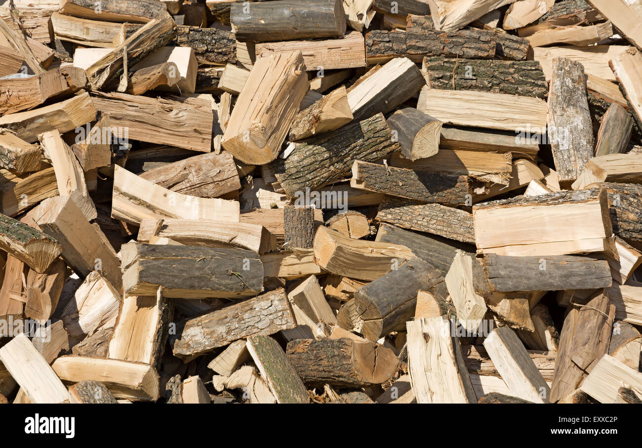 Firewood background. Chopped wood. Photographed a sunny day Stock Photo ...