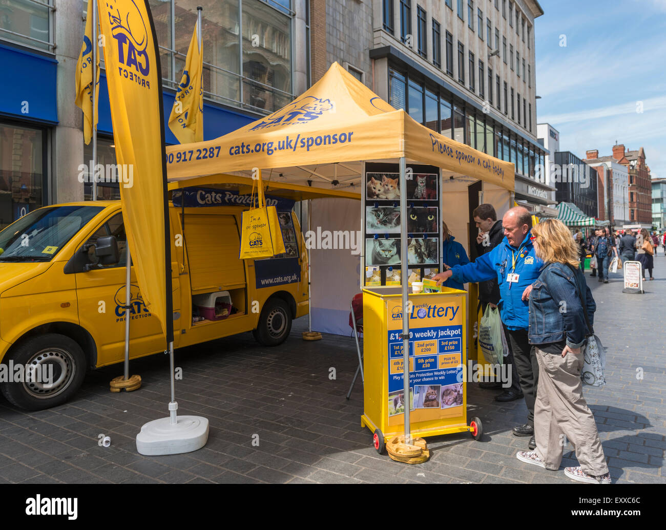 Cats Protection animal welfare charity stand in a city street, England ...