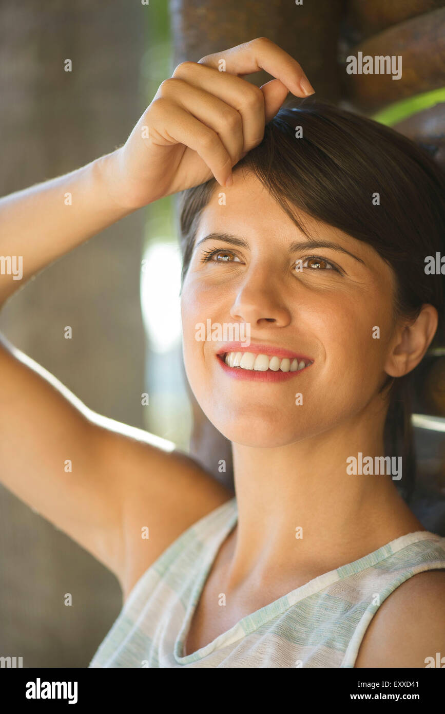 Woman looking up dreamily, portrait Stock Photo - Alamy