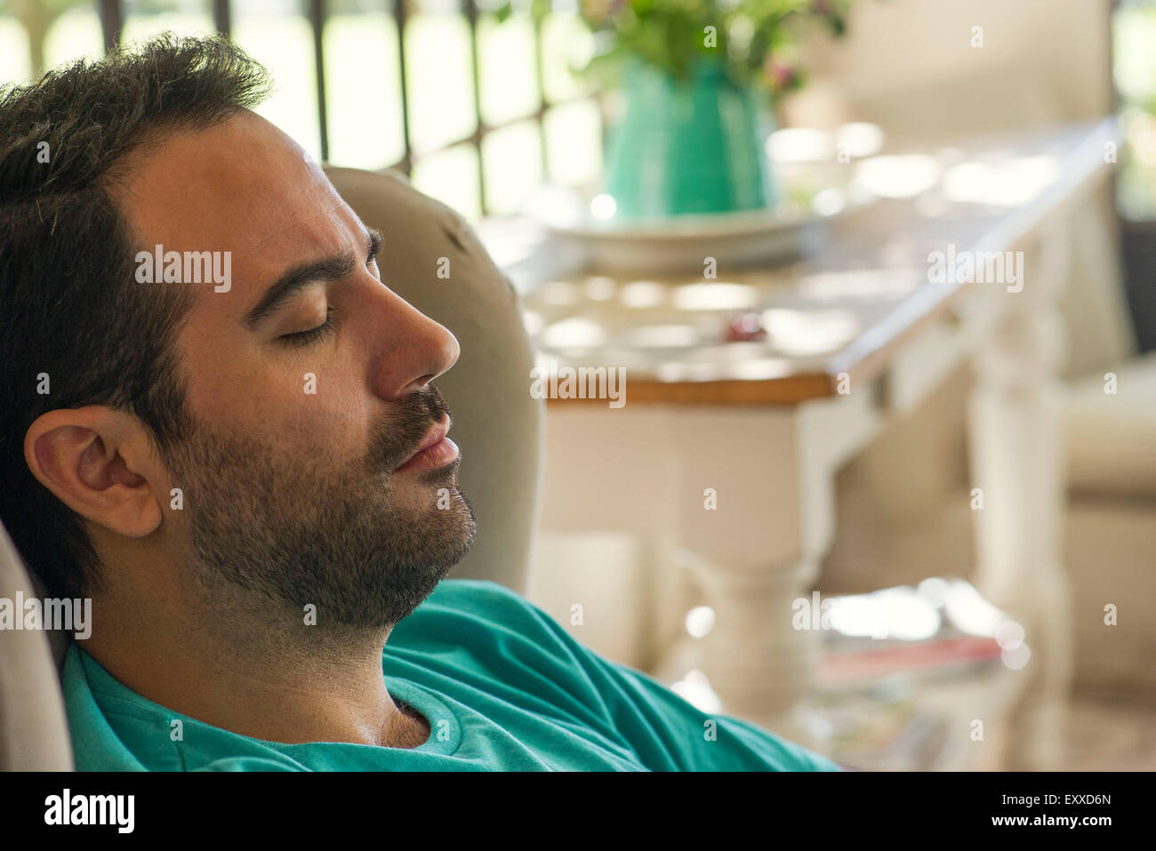 Man napping in armchair Stock Photo - Alamy