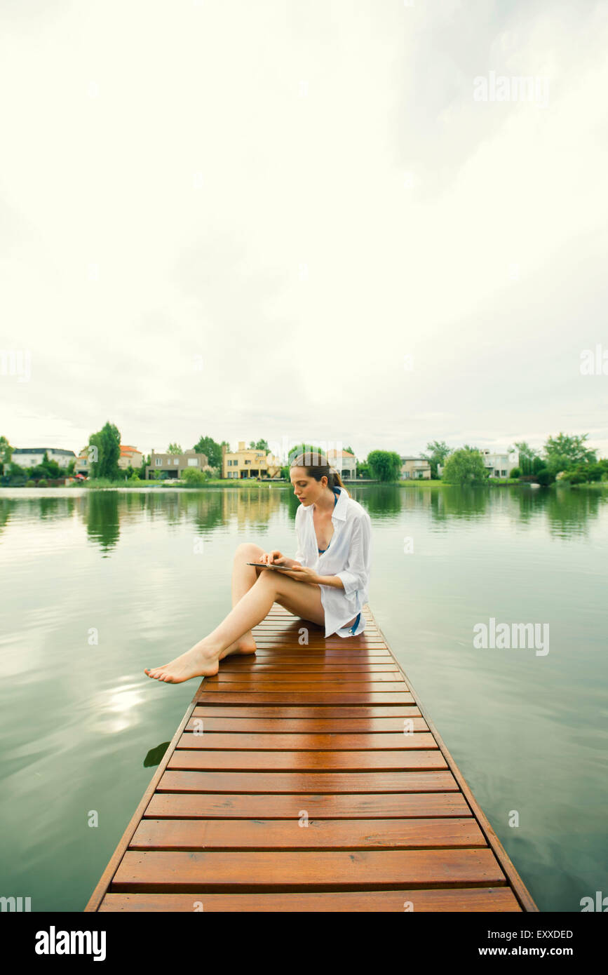 Full body of woman sitting bikini hi-res stock photography and images ...
