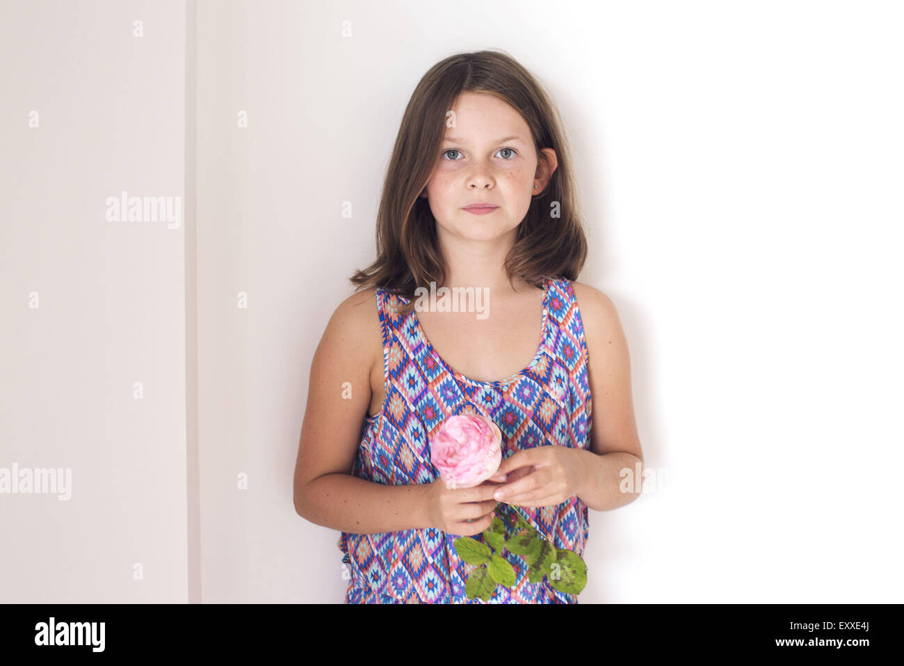 Girl holding rose, portrait Stock Photo - Alamy