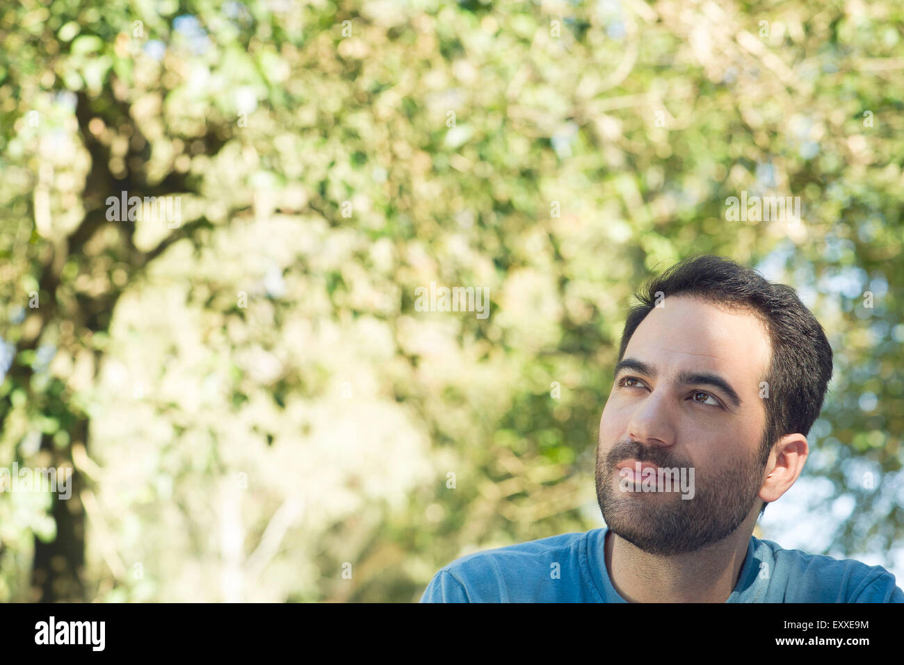 Man daydreaming outdoors Stock Photo - Alamy