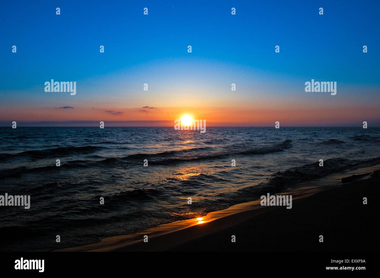 Blue Sky Sunset on the Lake Stock Photo - Alamy