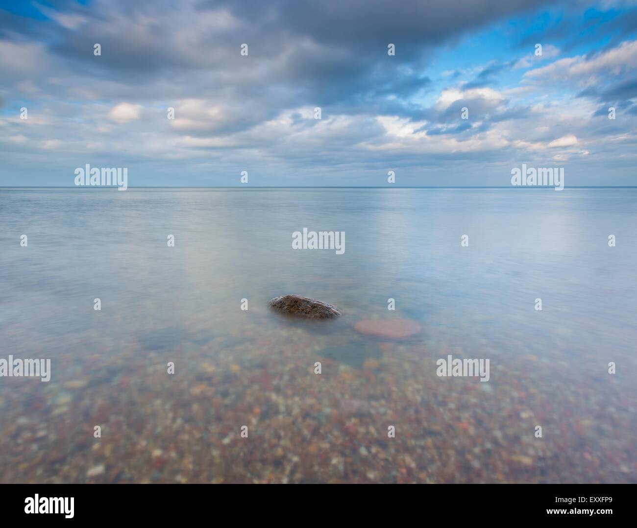 Beautiful long exposure landscape of rocky sea shore. Tranquil scene of ...