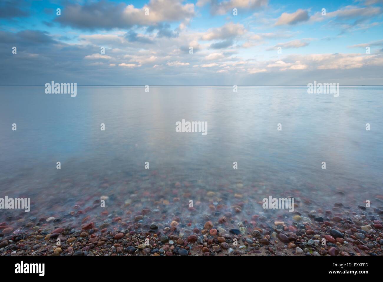 Beautiful long exposure landscape of rocky sea shore. Tranquil scene of ...