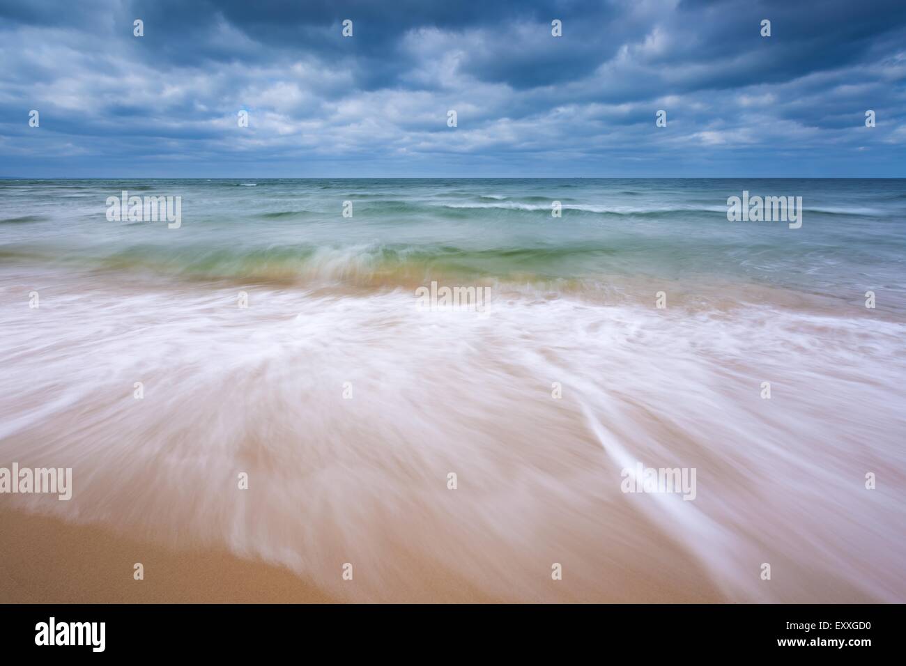Beautiful beach landscape with cloudy sky and sea with waves. Baltic ...