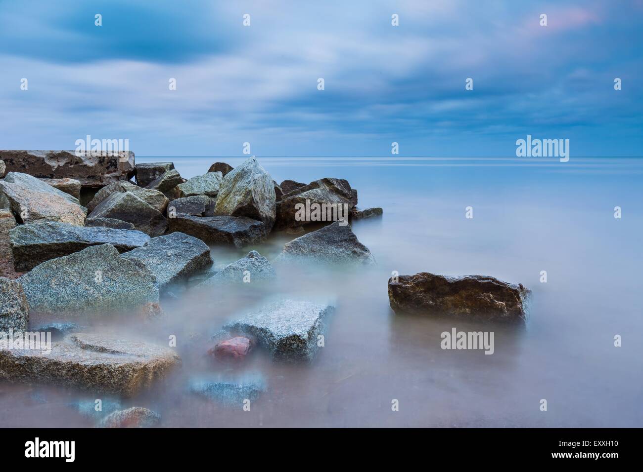 Beautiful Baltic sea landscape with stone breakwater. Tranquil long ...