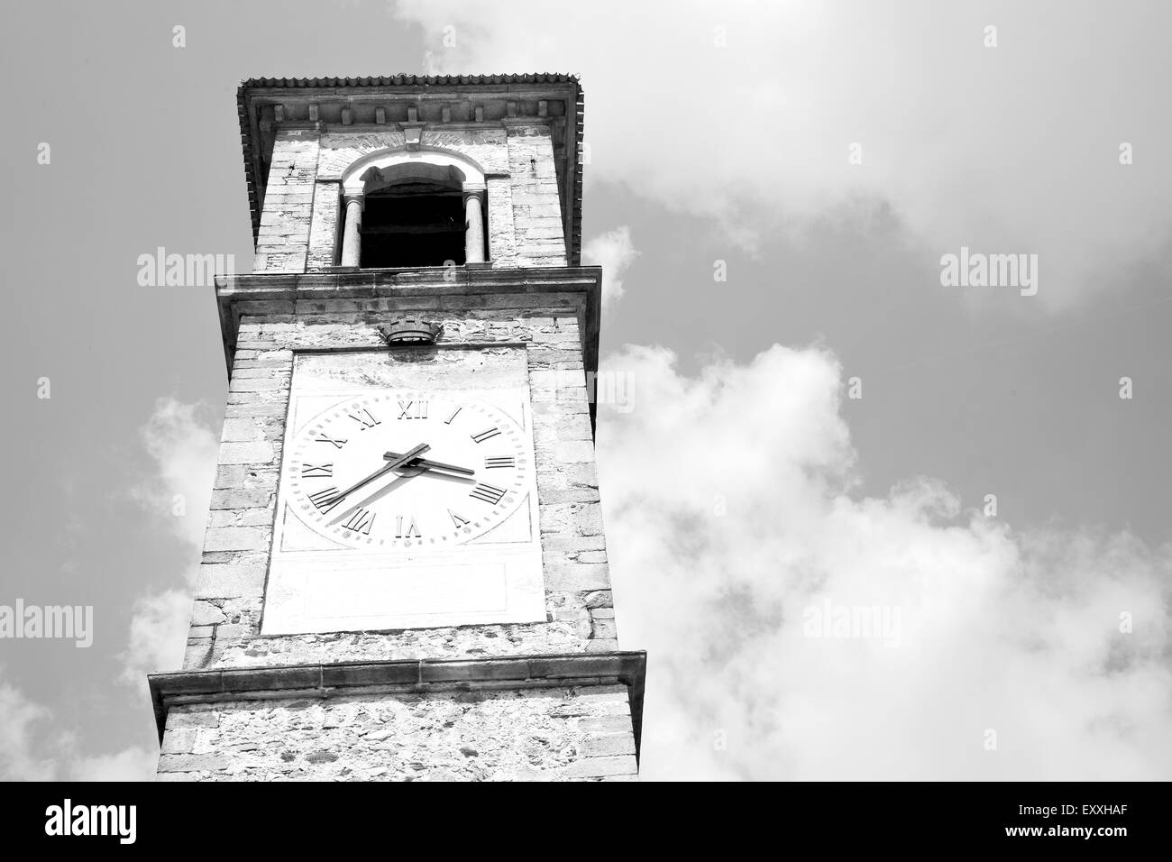 ancien clock tower in italy europe old stone and bell Stock Photo - Alamy