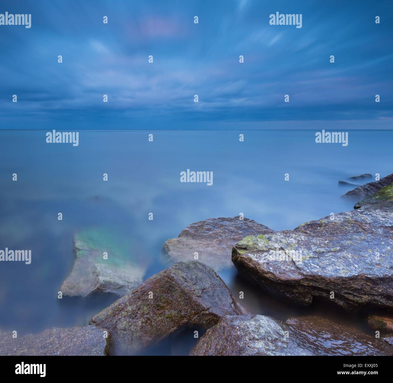 Beautiful Baltic sea landscape with stone breakwater. Tranquil long ...