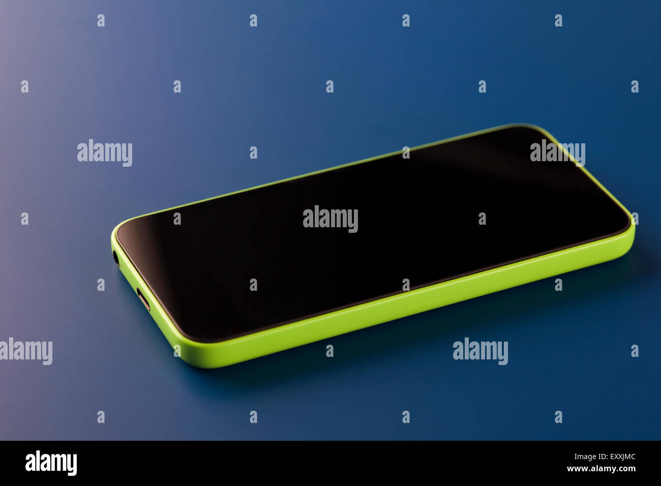 Smart phone on blue background Stock Photo - Alamy